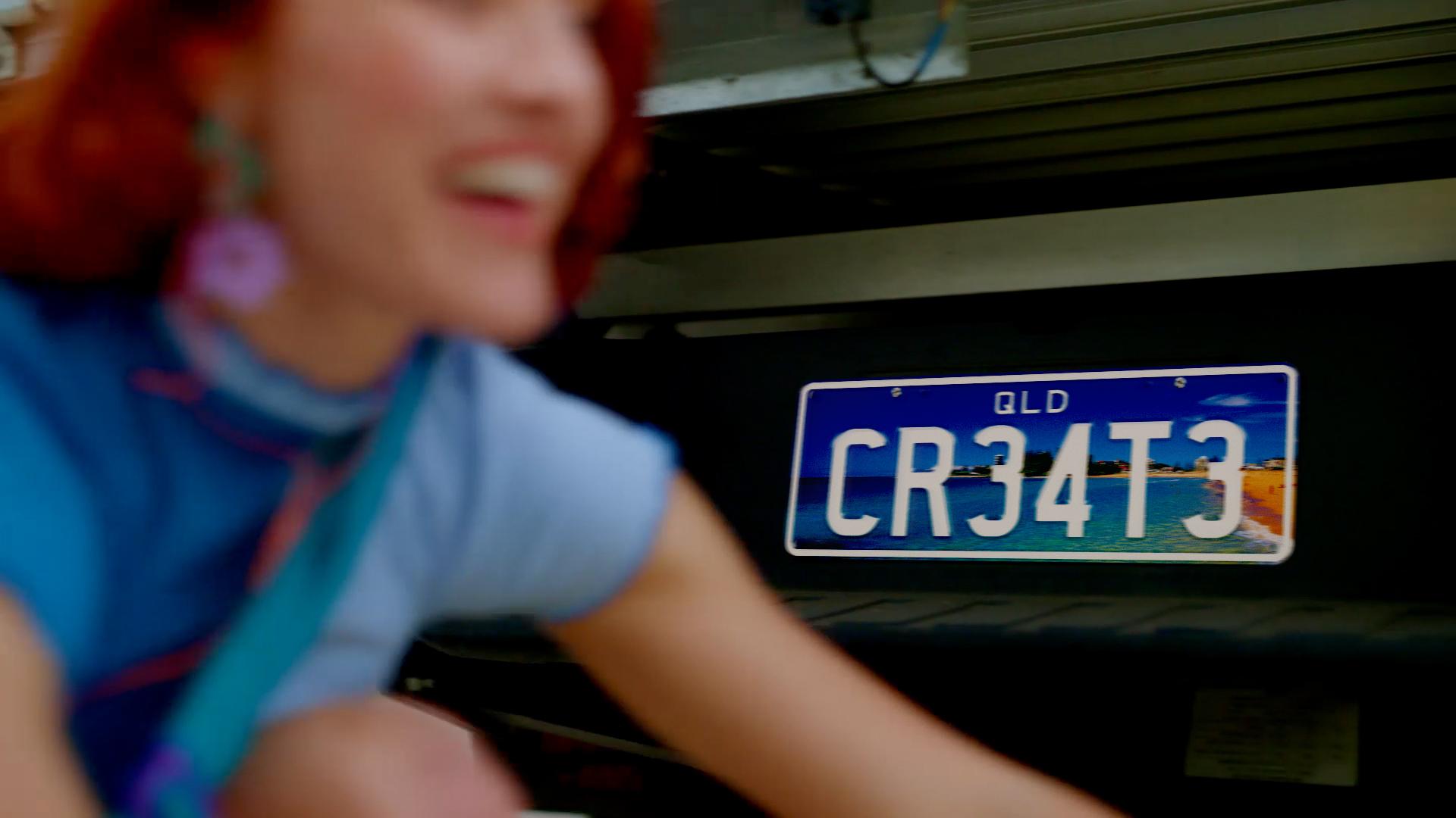 A rollerskater skating past the personalised number plate C R 3 4 T 3
